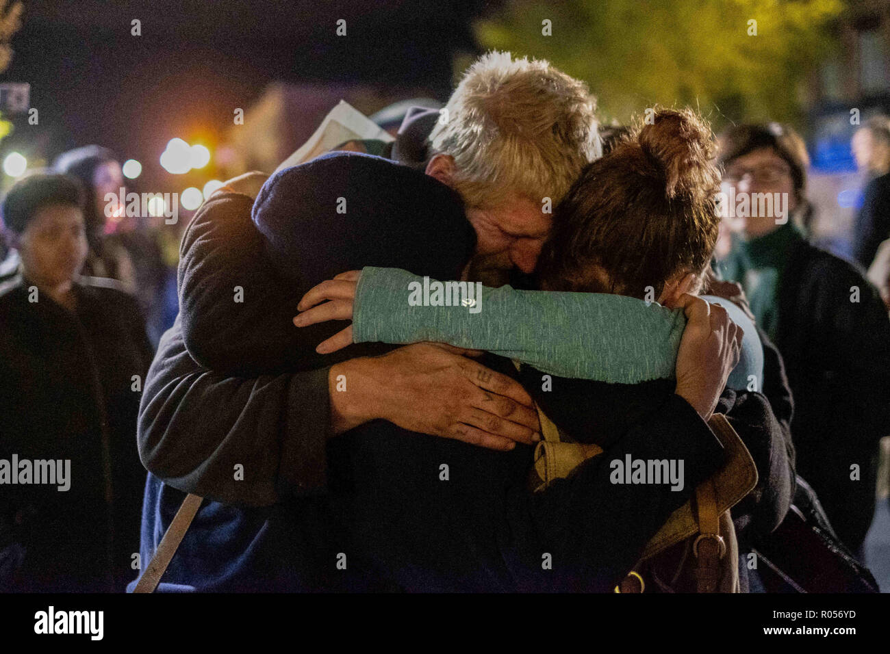 Pittsburgh, PA, USA. 30th Oct, 2018. Three people hug during the If Not ...