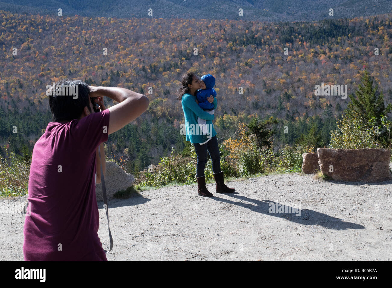 Father Photographing moth and child with fall foliage Stock Photo - Alamy