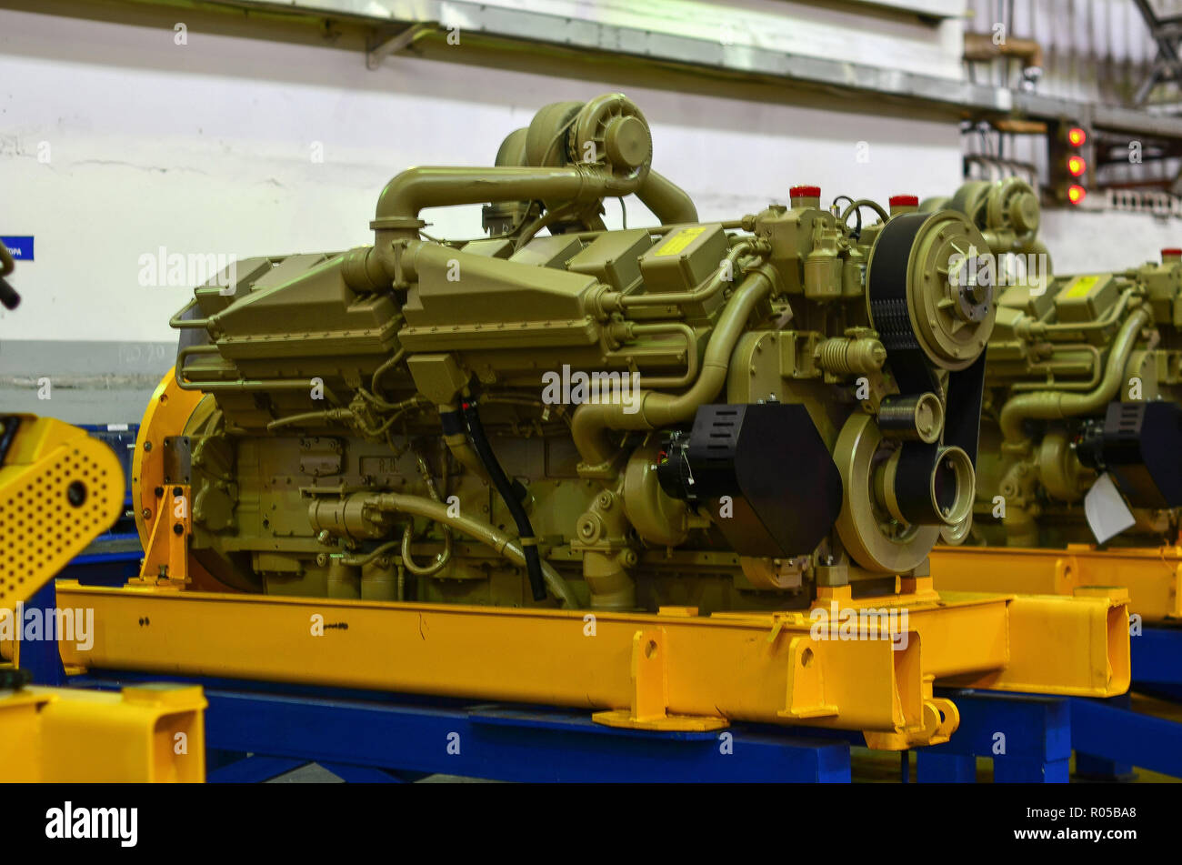 Large diesel engine with a huge turbine in the warehouse of finished ...