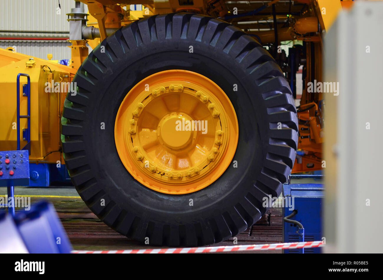 Tires with rims and electric motor-wheels engines of a yellow career ...