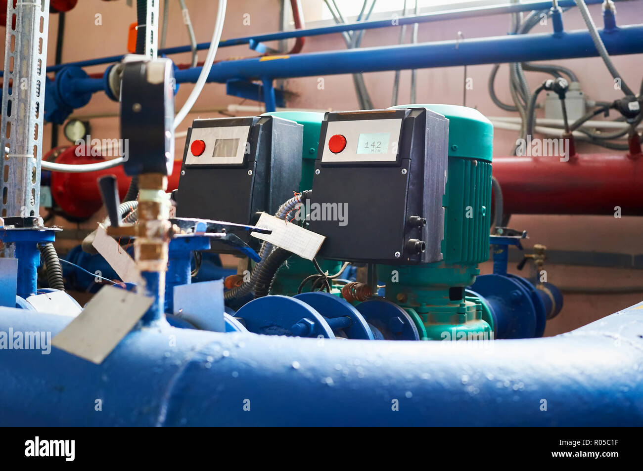 Blue pump motor and the inverter connected to the pipes blue Stock ...