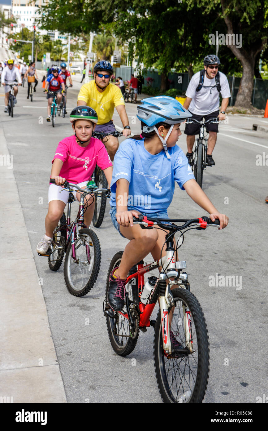 Child riding bike helmet hispanic hi-res stock photography and images ...
