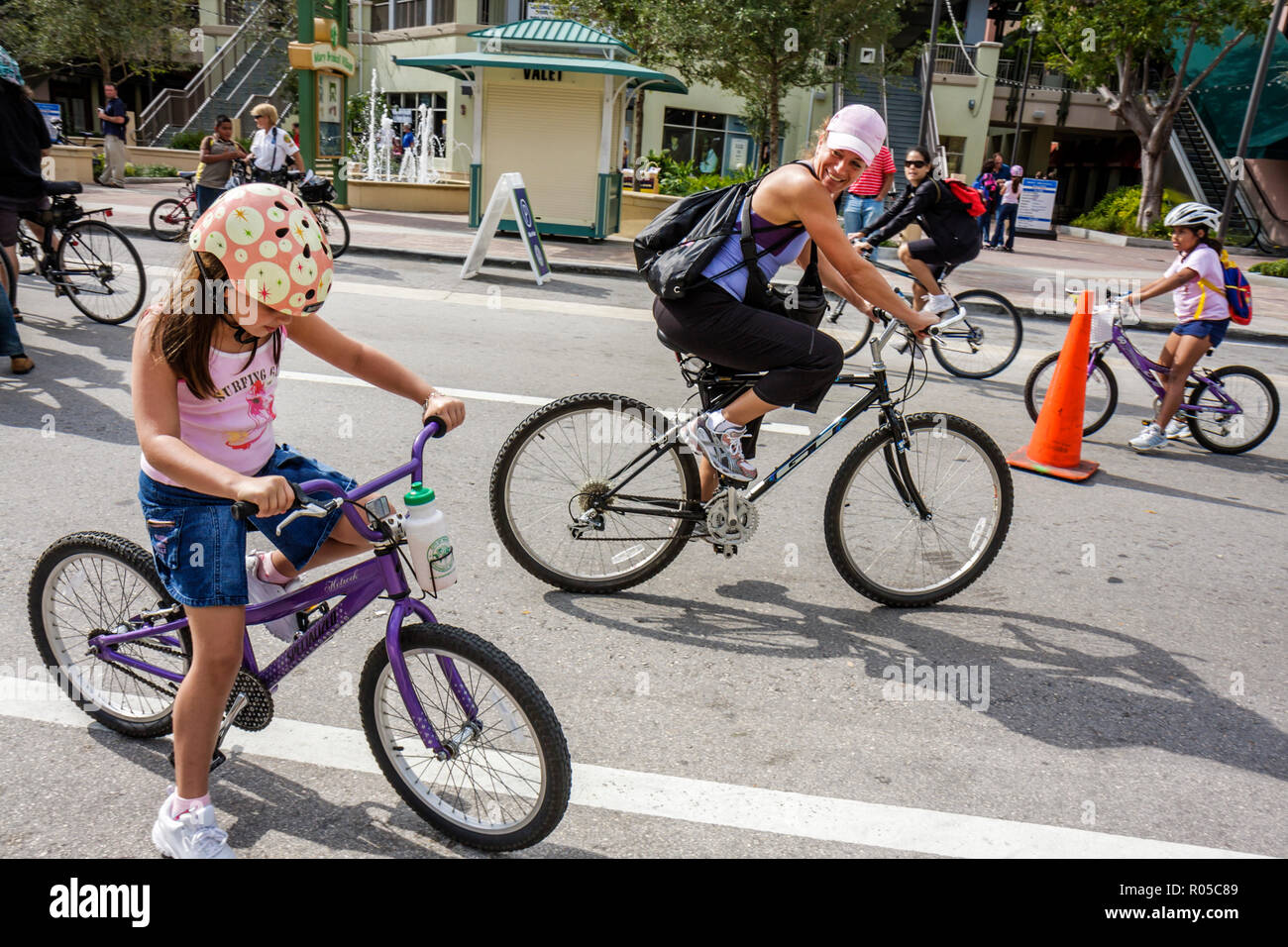 Child riding bike helmet hispanic hi-res stock photography and images ...