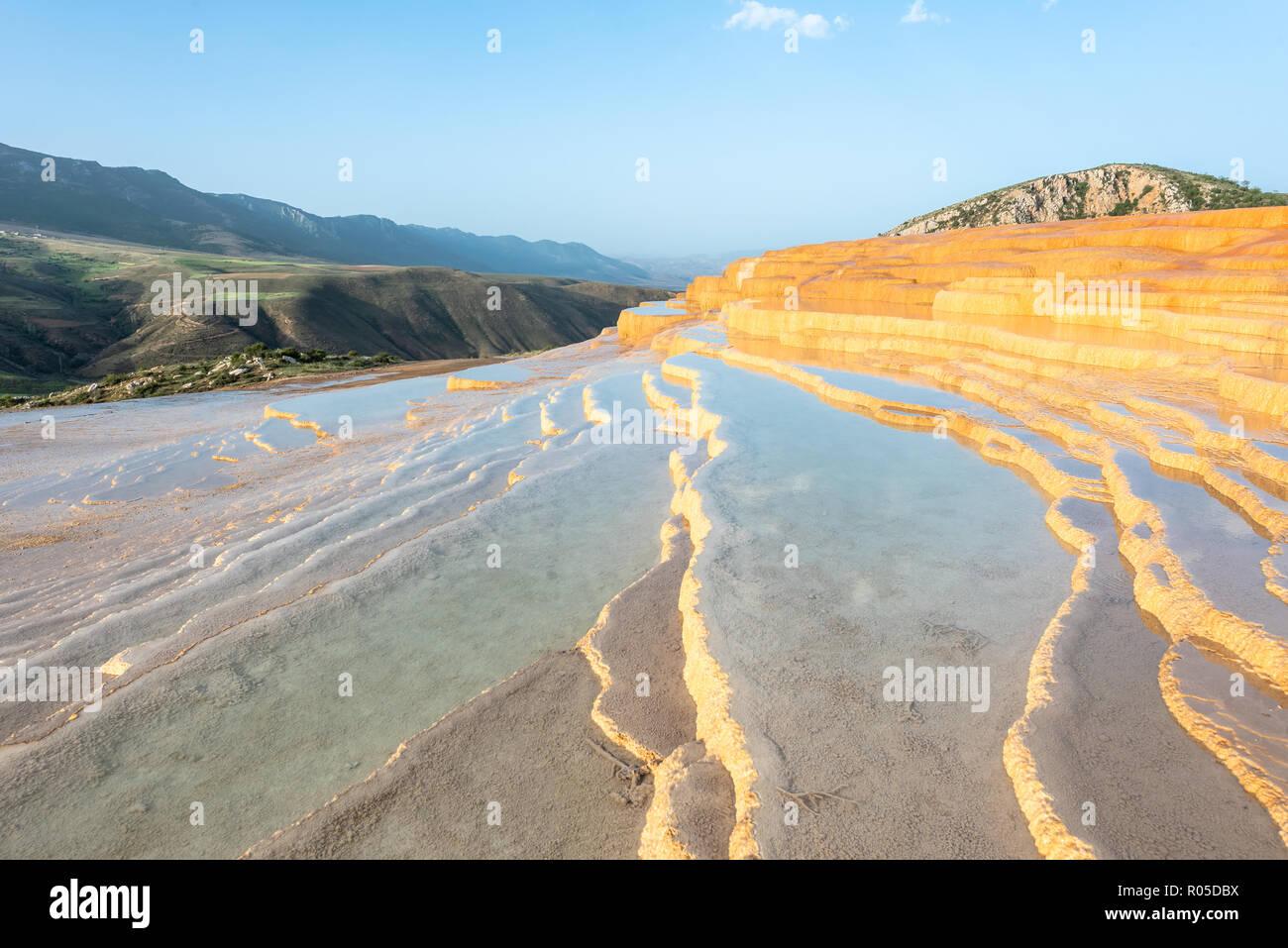 Travertine terrace at sunrise near Orost, one of the rare pure ...