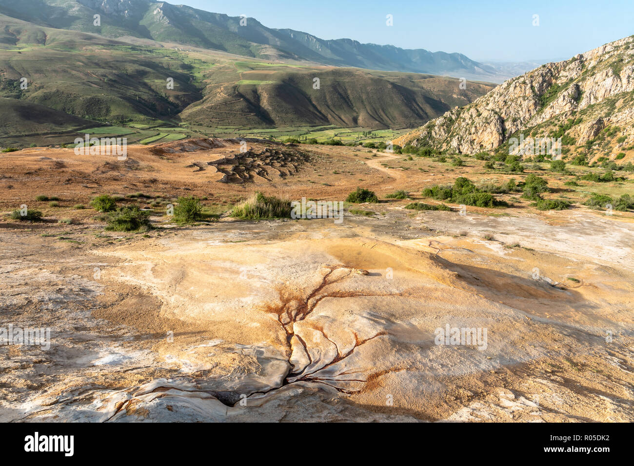 Travertine terrace at sunrise near Orost, one of the rare pure ...