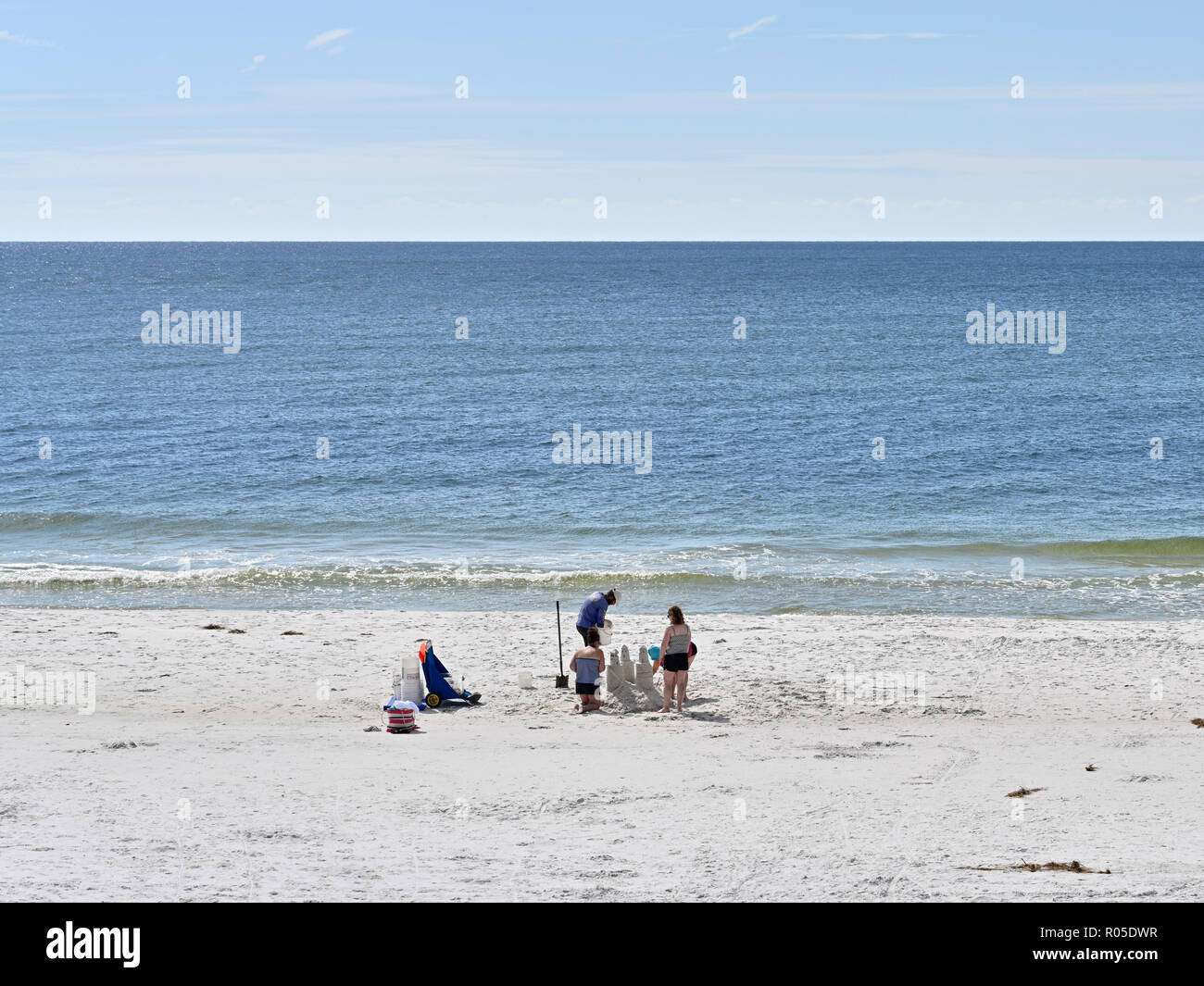 Family building a sand castle on the Florida beach at Deer Lake State ...