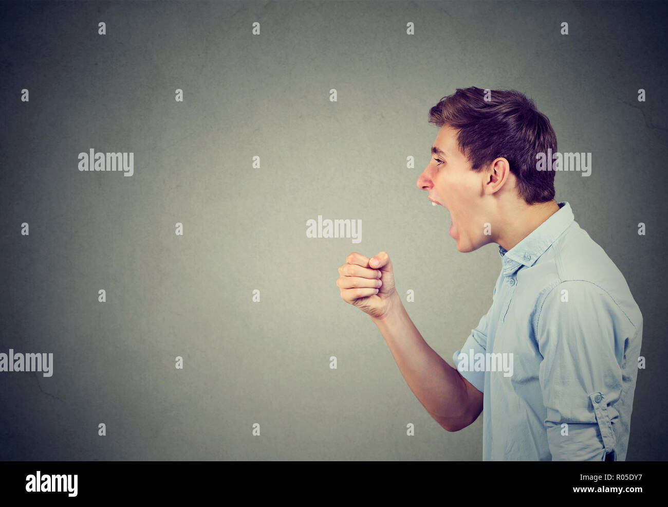 Side profile young man screaming hi-res stock photography and images ...