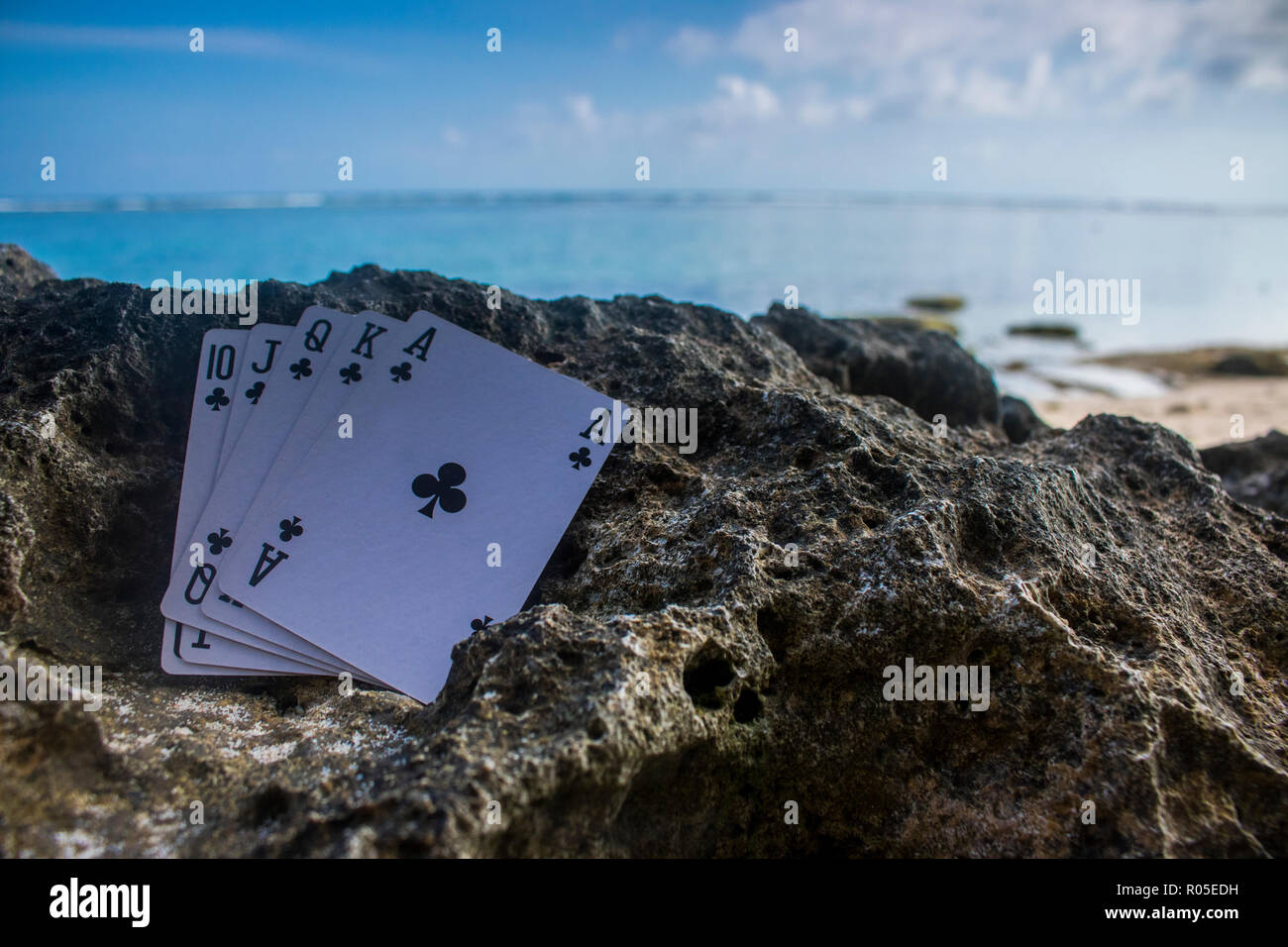 club royal flush poker card gamble beach theme Stock Photo - Alamy