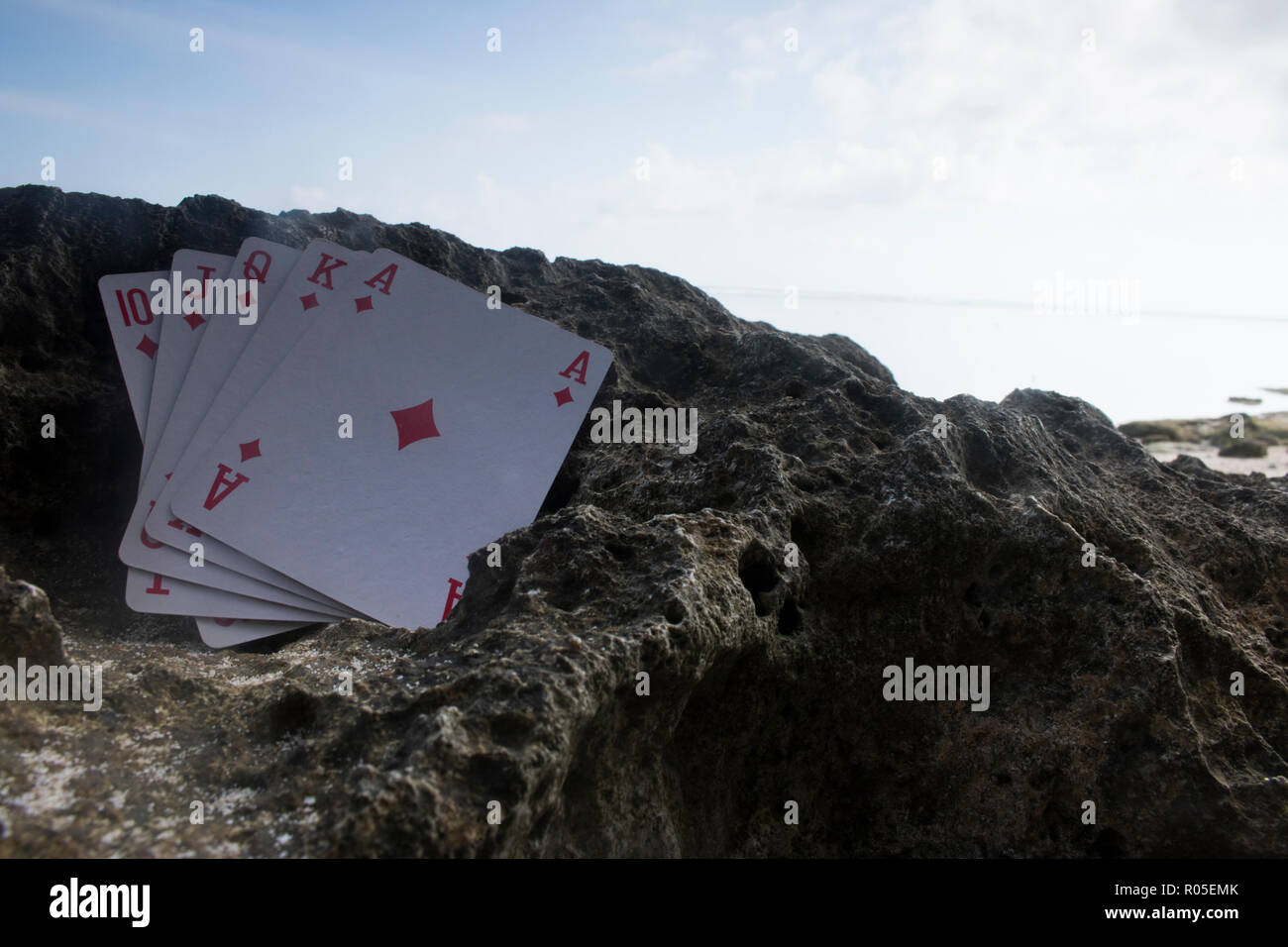 diamond royal flush poker card gamble beach theme Stock Photo - Alamy