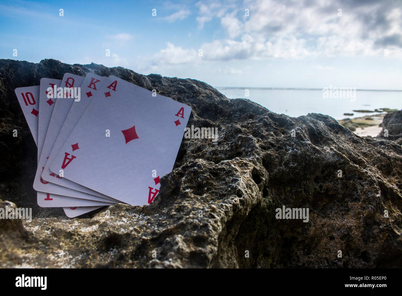 diamond royal flush poker card gamble beach theme Stock Photo - Alamy