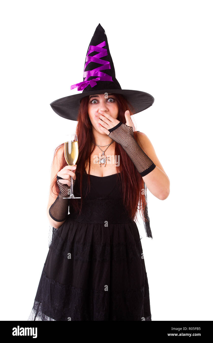 Picture of laughing witch in black hat, with glass of champagne on ...