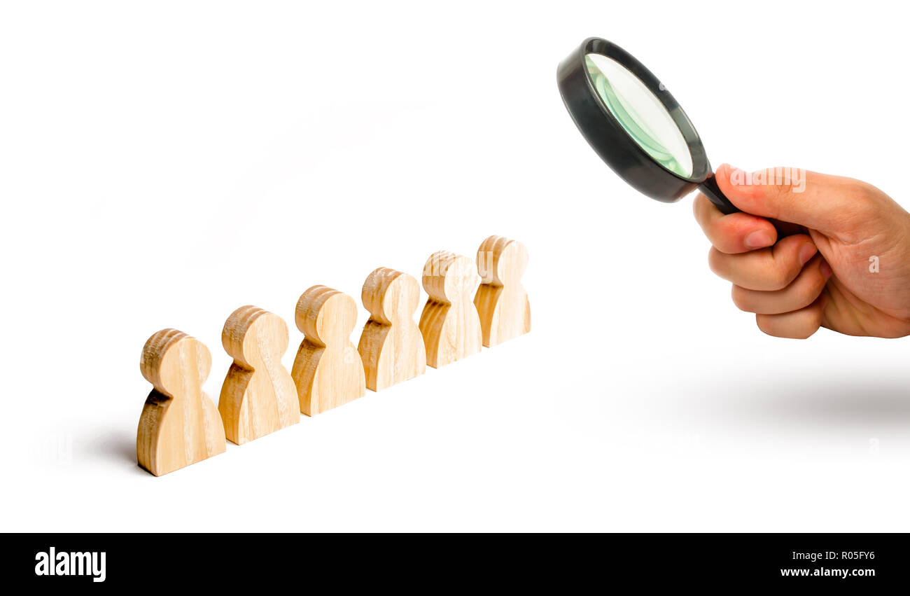 Magnifying glass is looking at the People stand in a formation on a ...