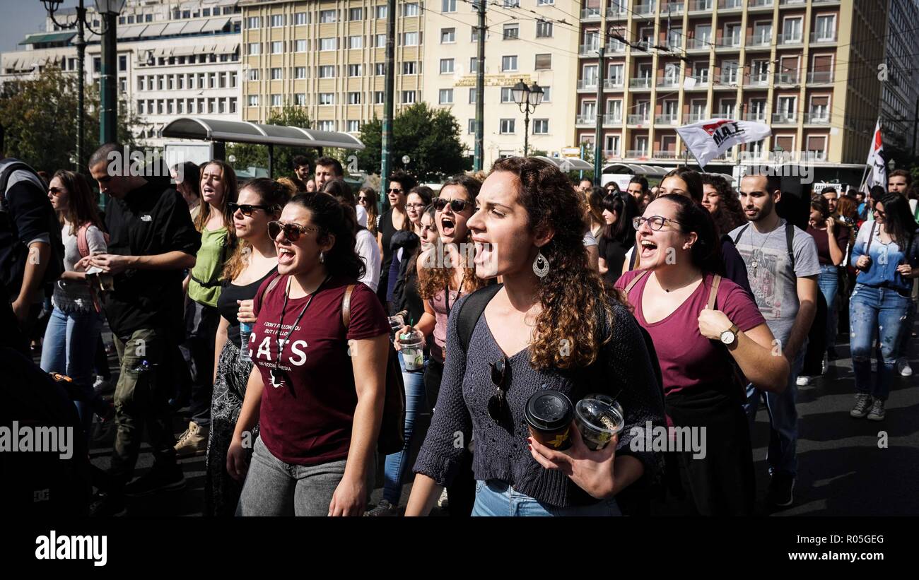 University students are seen walking while shouting during the protest ...