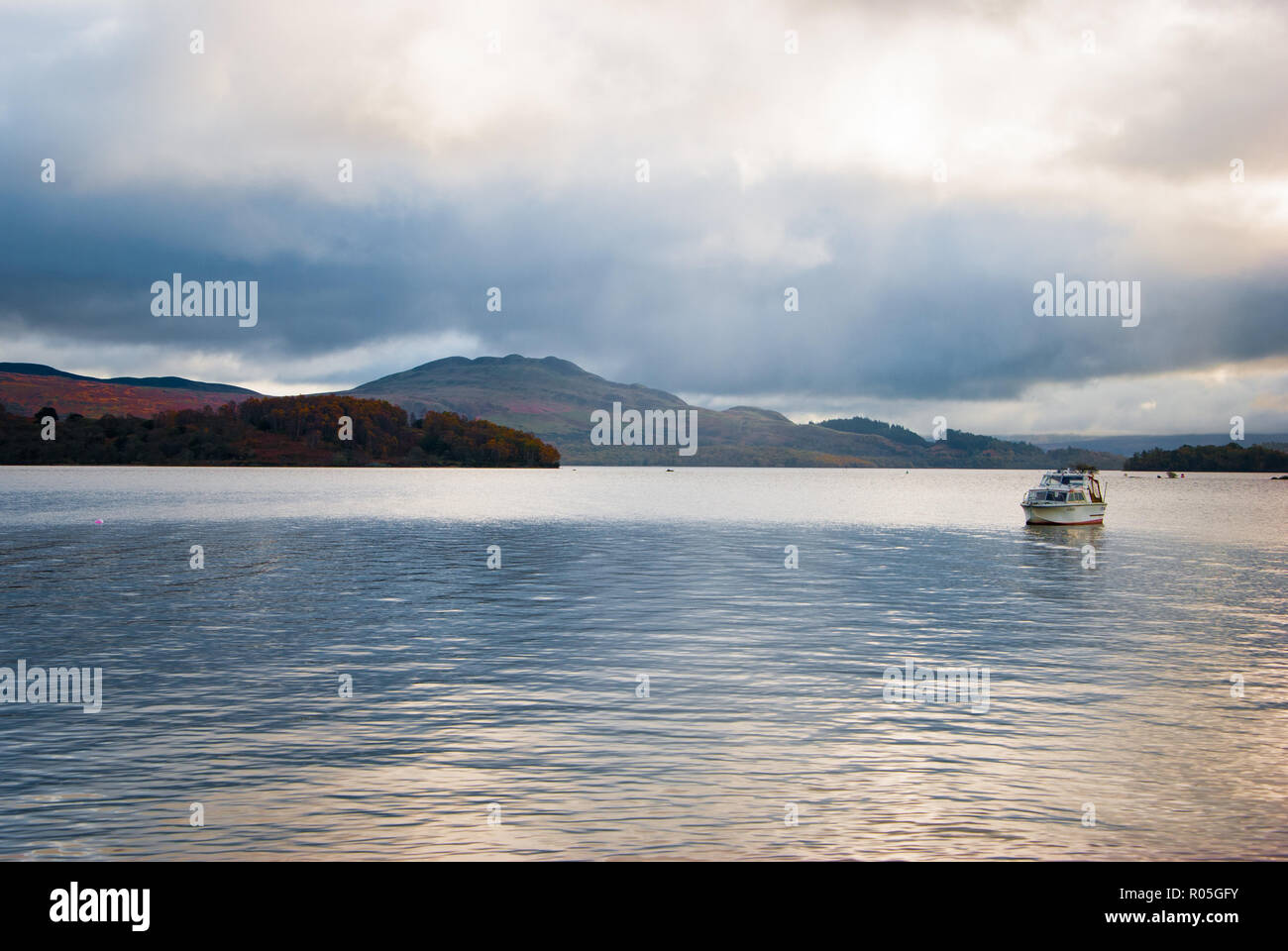 The ice-cold sea with a boat and clouds Stock Photo - Alamy