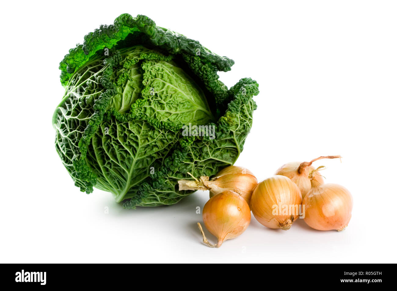 fresh savoy cabbage an isd five onions isolated on white background ...
