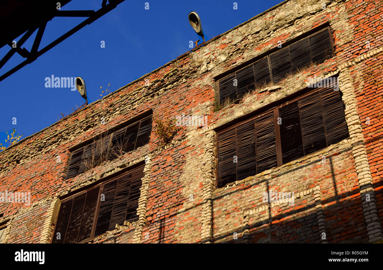 The wall of the building of an industrial plant of red brick ...