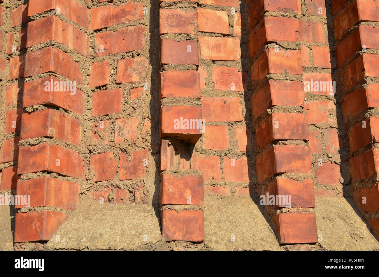 Red brick fence. Red brick wall texture background Stock Photo - Alamy