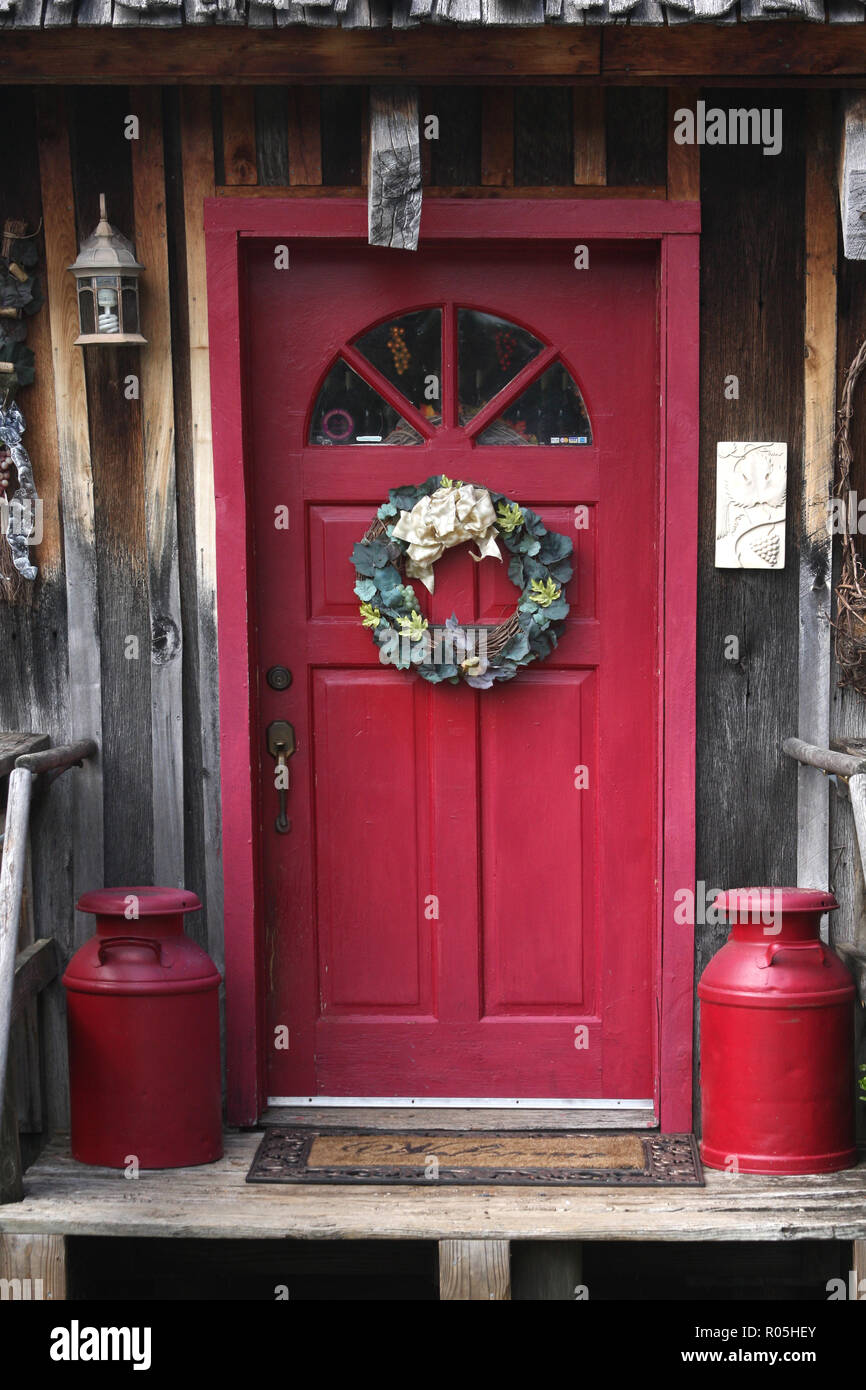 Red door decorated in rustic style. Entrance to farm store Stock Photo ...