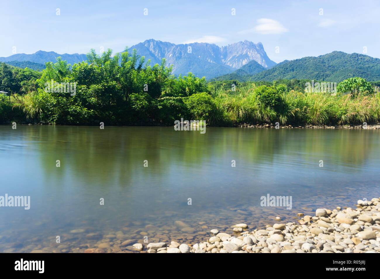 Landscape of rural Sabah Malaysia Borneo with river flowing and the ...