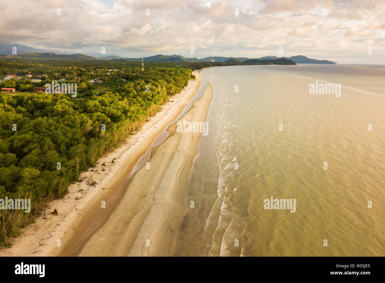 Aerial view of Sabandar Beach in Tuaran Sabah during sunset with white ...