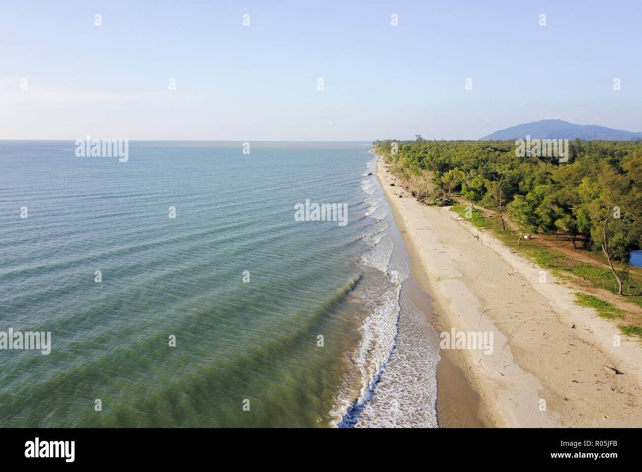 Aerial view of Sabandar Beach in Tuaran Sabah during blue sky afternoon ...