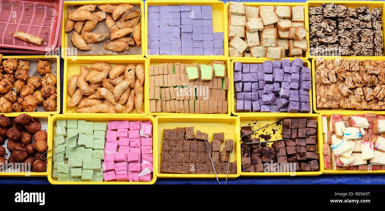 Variety of delicious and colorful Malaysian home cooked local cakes or ...