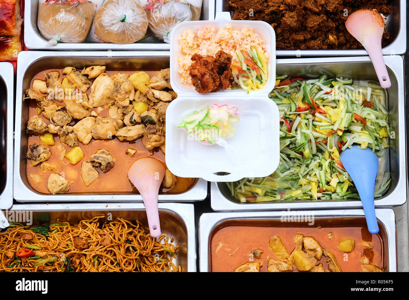 Variety of delicious Malaysian home cooked dishes sold at street market ...