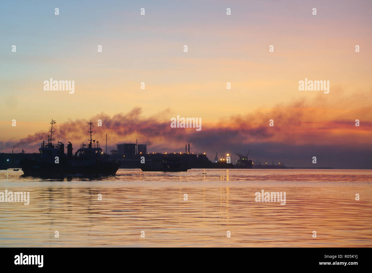 Sunrise at harbor port at Sabah Malaysian Borneo with industrial ...