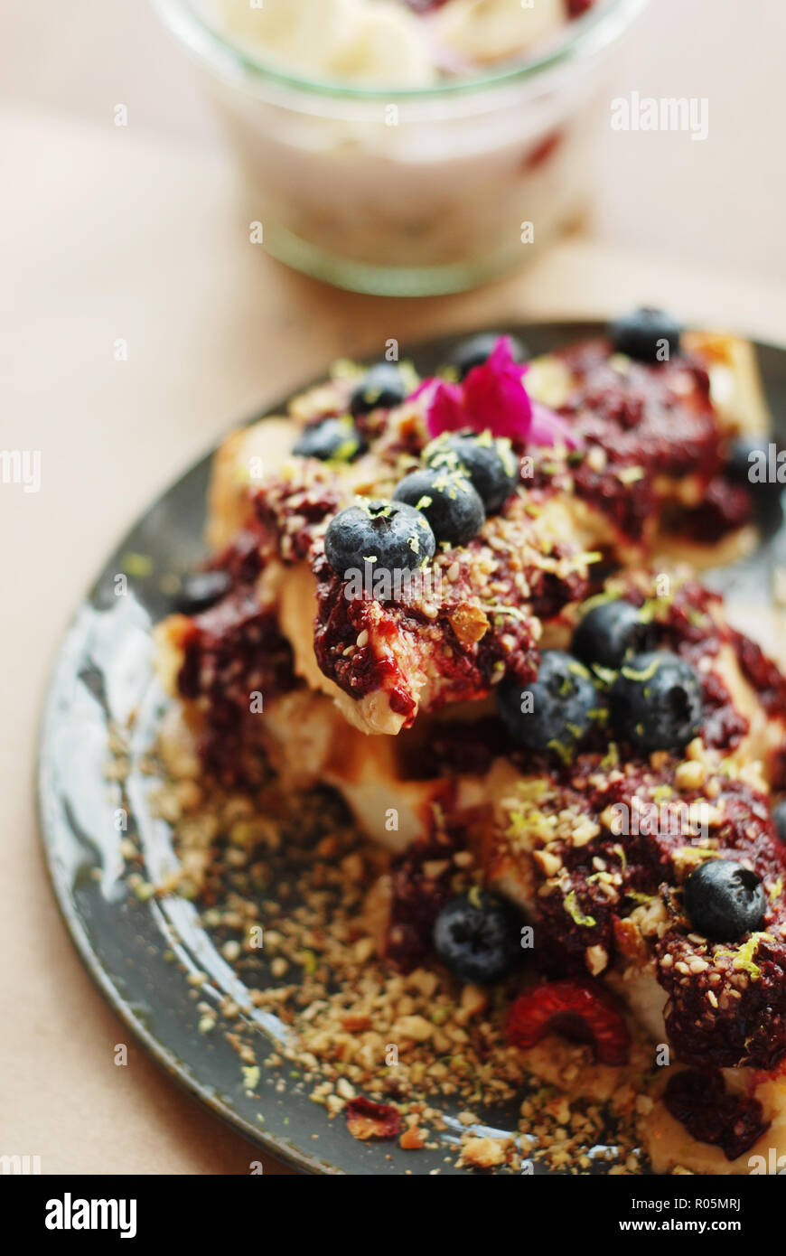 Delicious waffle with fruits closeup, healthy raw vegan breakfast in a ...