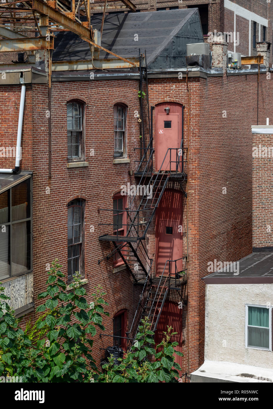 A fire escape on a brick building in the city Stock Photo - Alamy