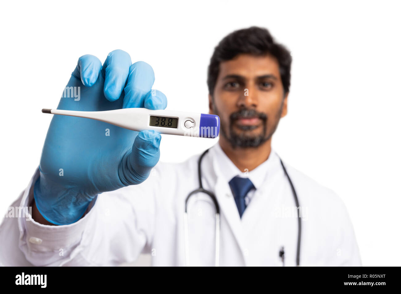 Thermometer showing high temperature as held by indian doctor with ...
