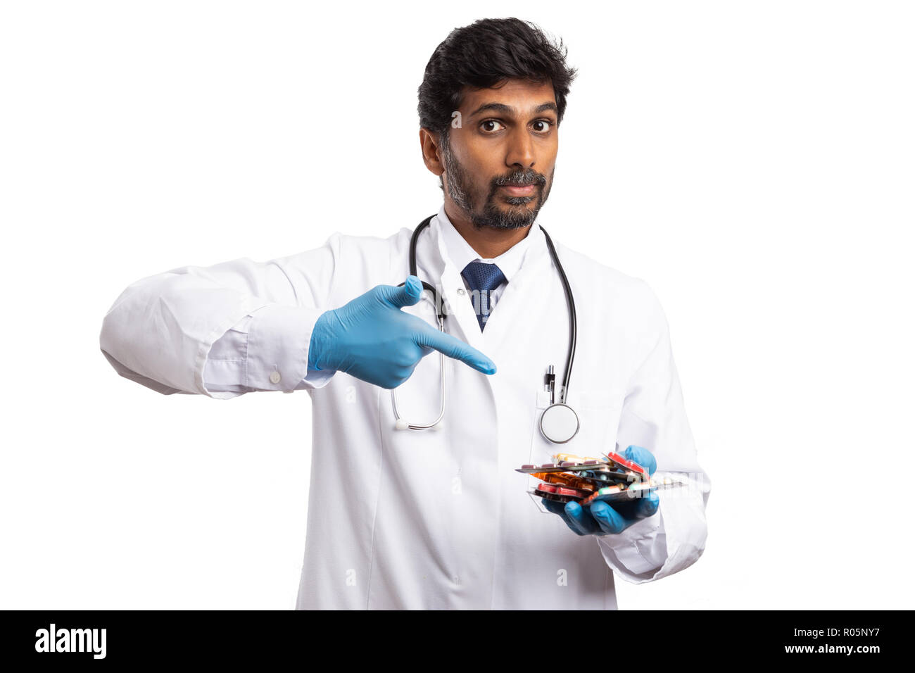 Indian medic indicating handful of medicine with index finger isolated ...