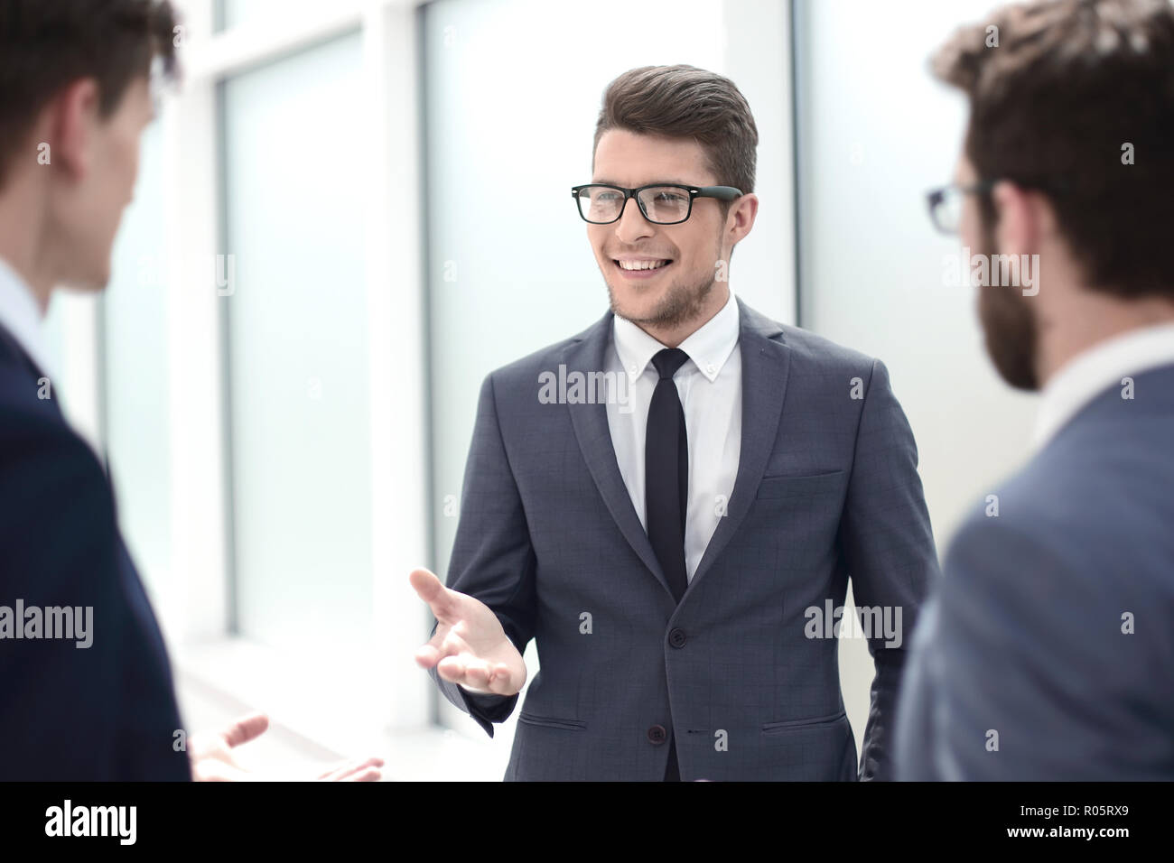 boss talking to employees standing in the office.business concept Stock ...