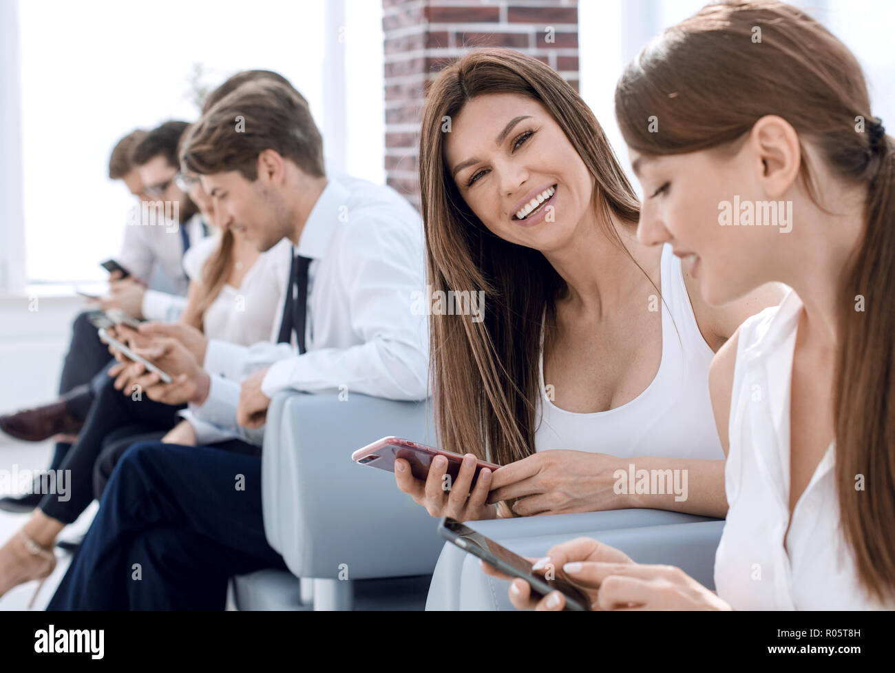 young colleagues sitting in the office hallway.people and technology ...