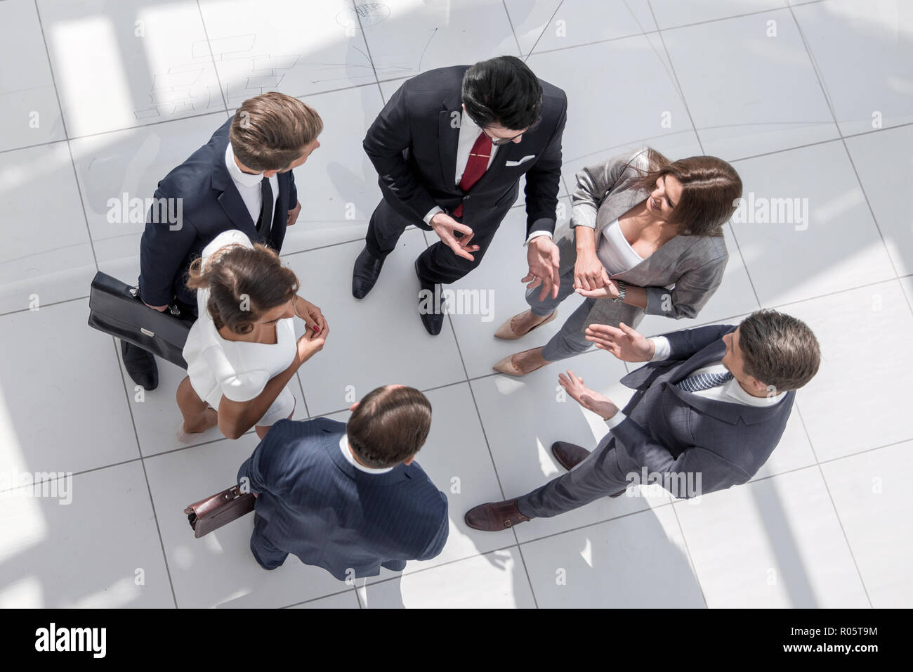 top view. employees discussing current tasks. photo with text space ...