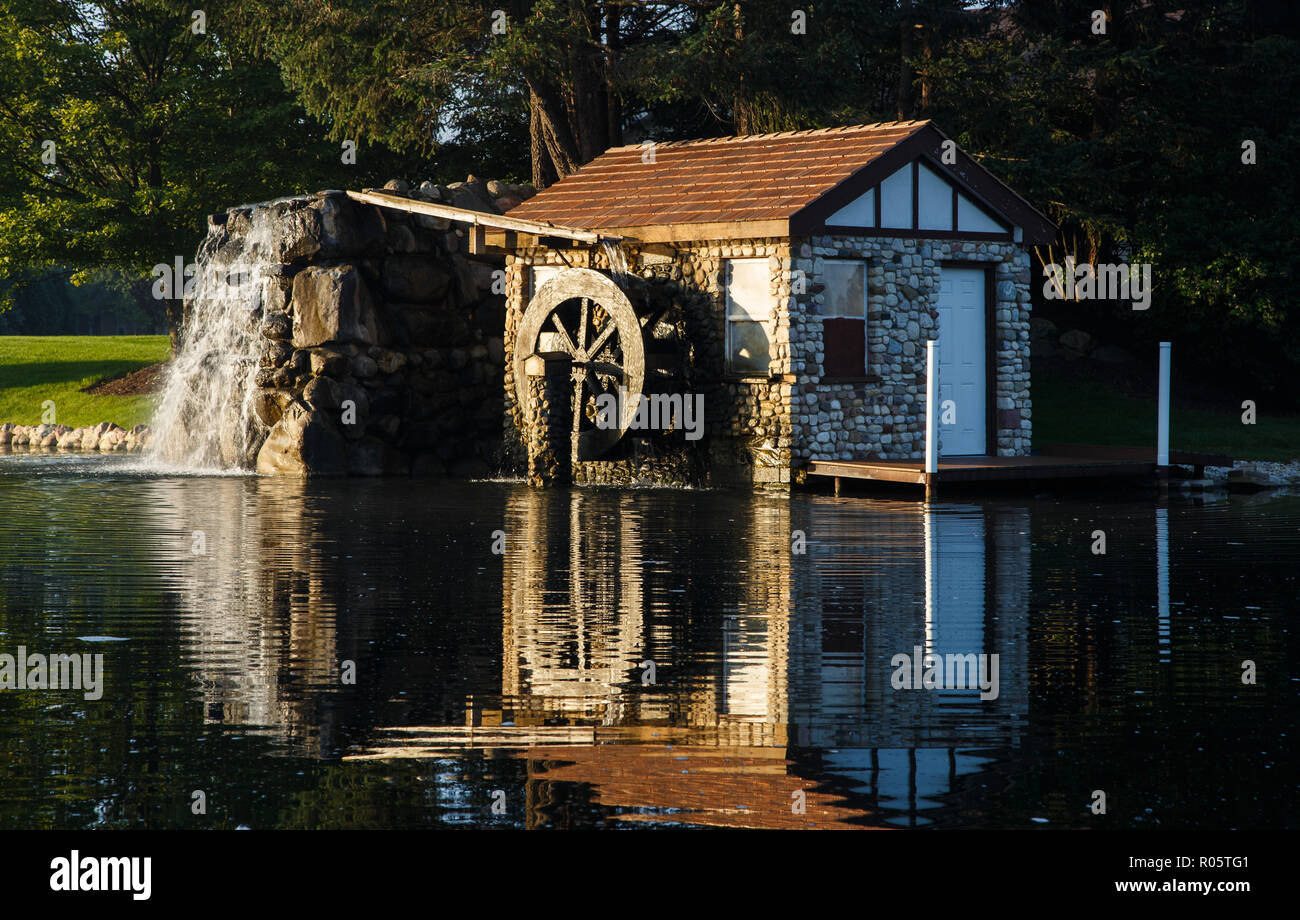 A decorative watermill by the entrance to a gated community Stock Photo ...