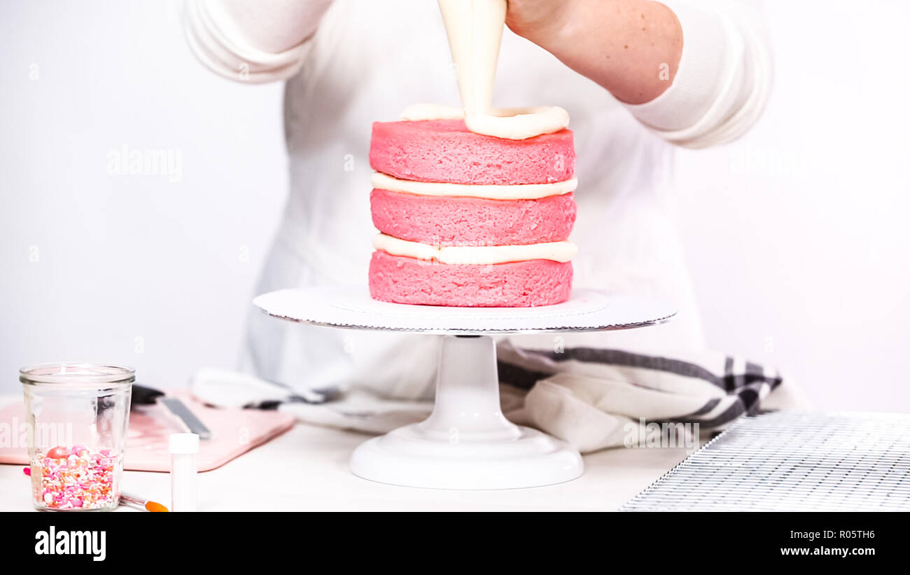 Step by step. Stacking layers together of pink birthday cake Stock ...