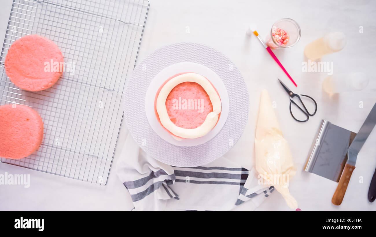 Step by step. Flat lay. Stacking layers together of pink birthday cake ...
