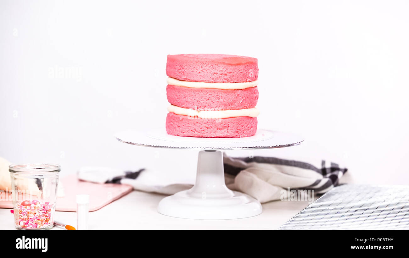 Step by step. Stacking layers together of pink birthday cake Stock ...