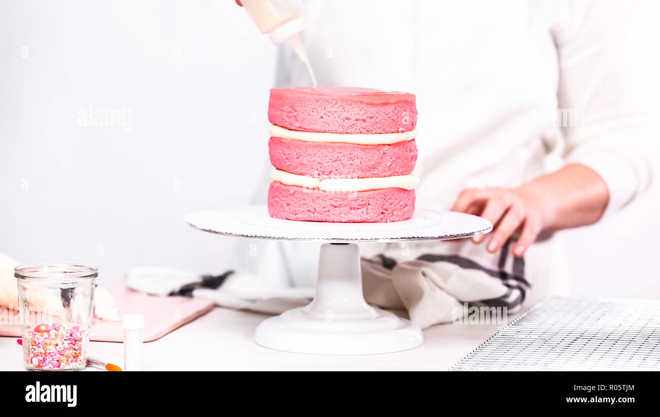 Step by step. Stacking layers together of pink birthday cake Stock ...