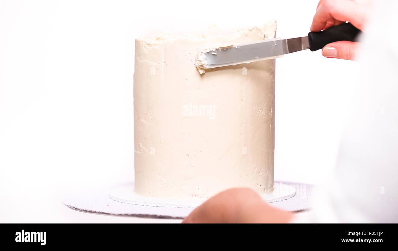 Step by step. Icing tall birthday cake with white buttercream icing ...