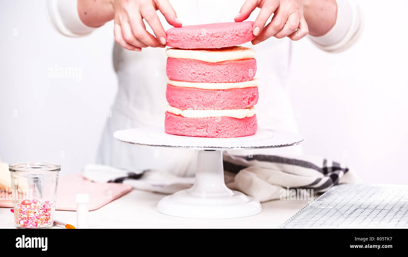 Step by step. Stacking layers together of pink birthday cake Stock ...