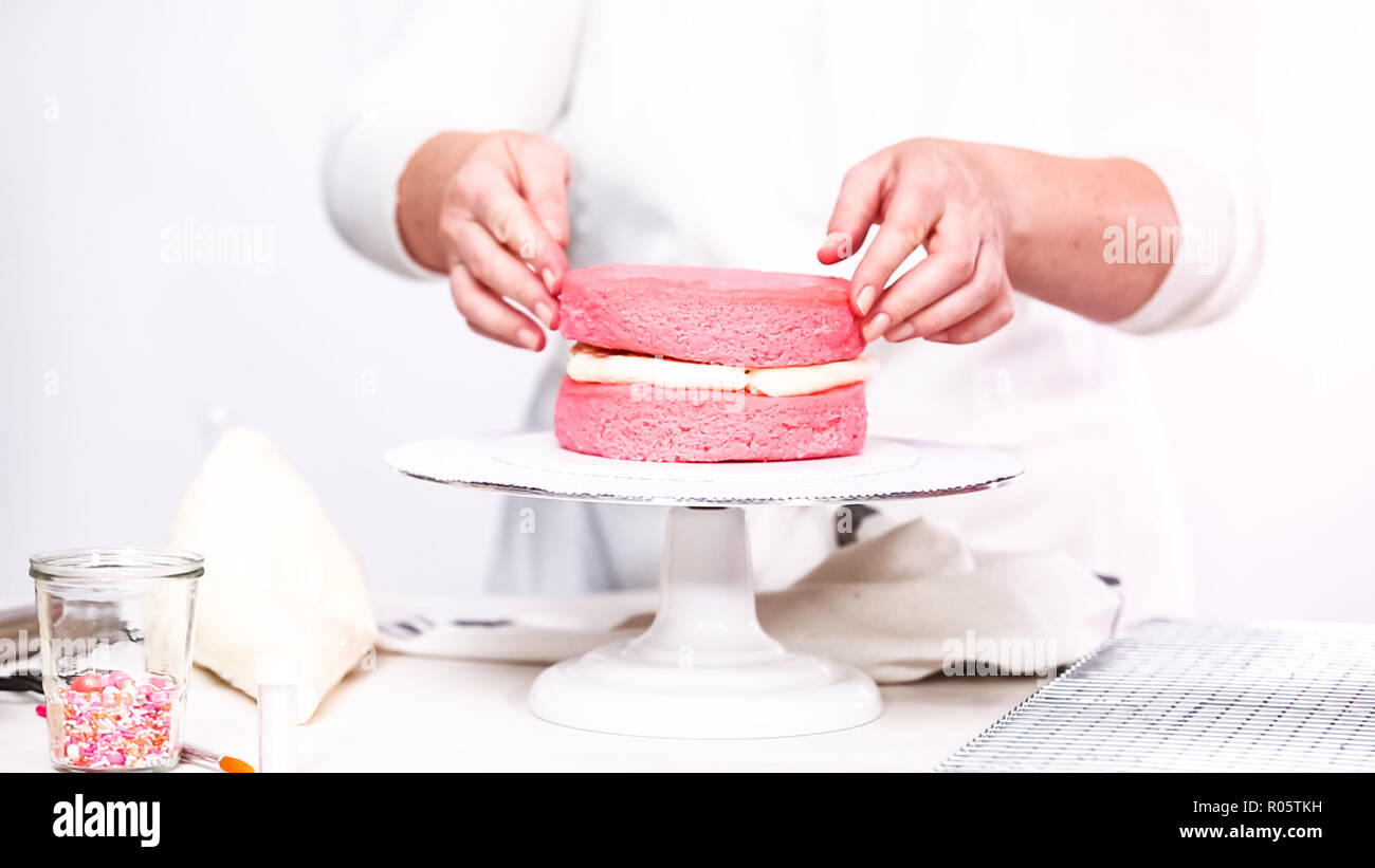 Step by step. Stacking layers together of pink birthday cake Stock ...