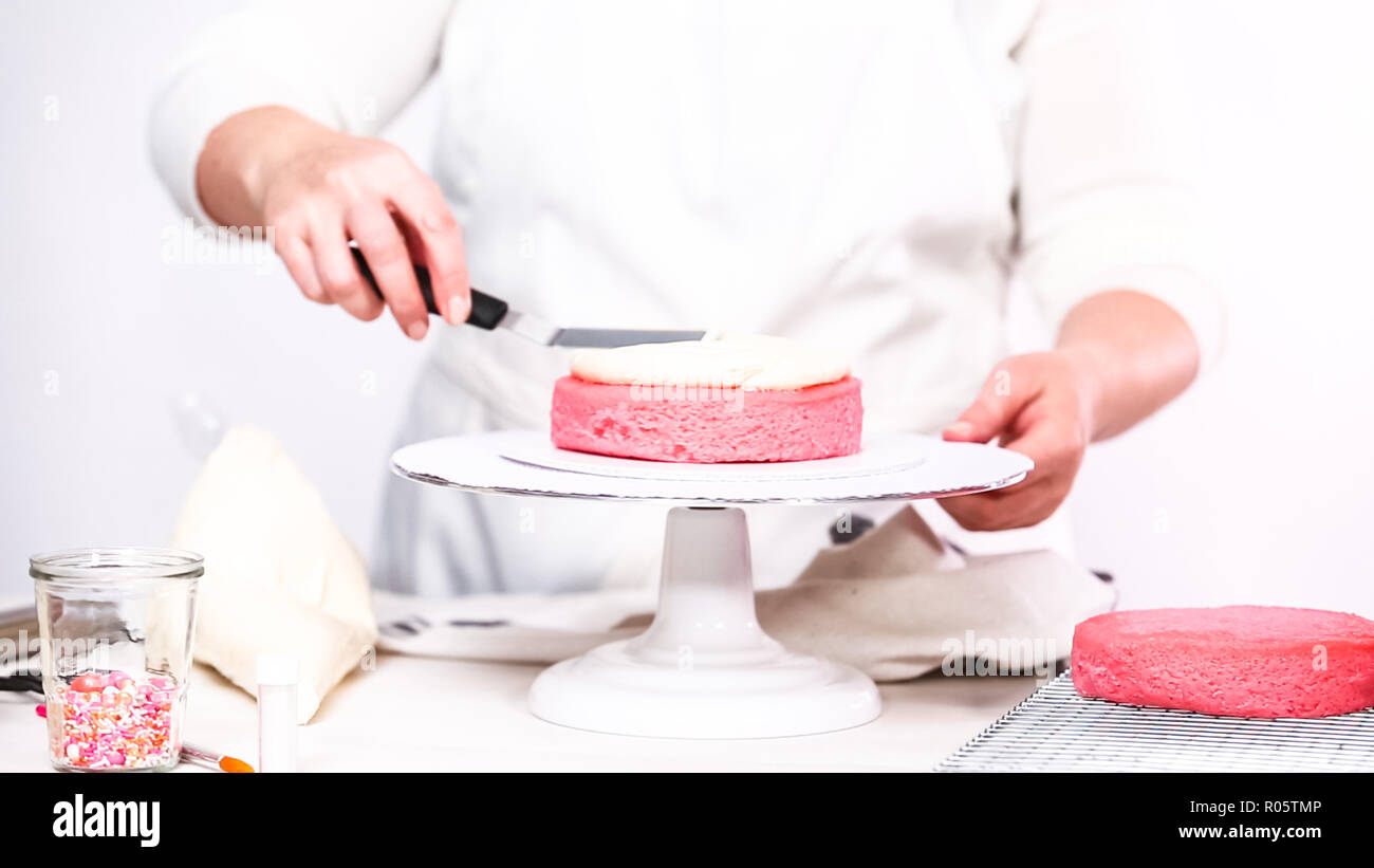 Step by step. Stacking layers together of pink birthday cake Stock ...