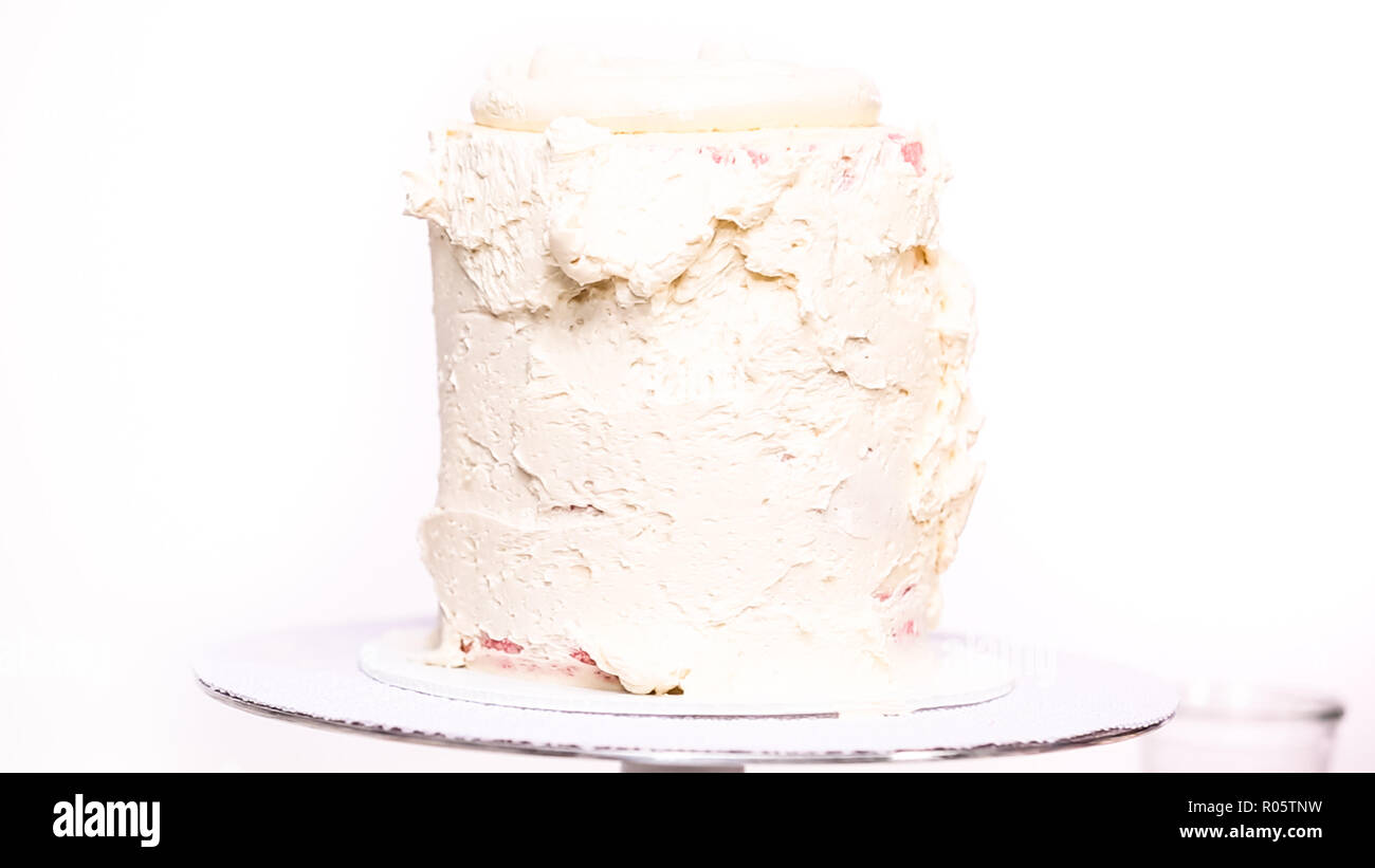 Step by step. Icing tall birthday cake with white buttercream icing ...