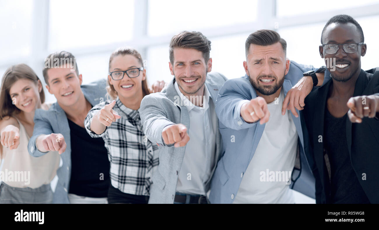 We choose you! Group of cheerful business people in casual wear ...