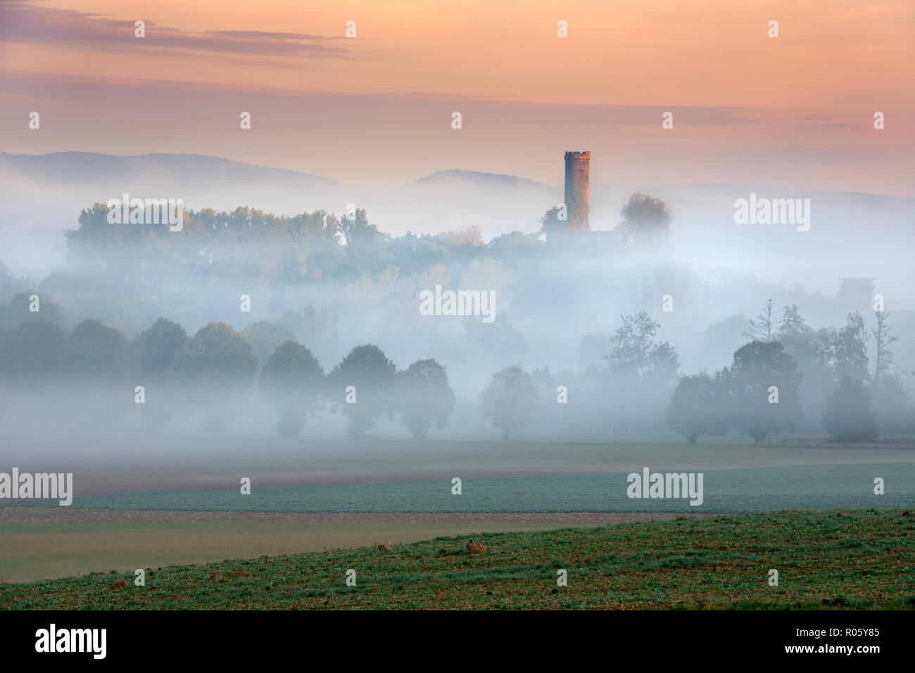 Landscape in North Hesse, morning fog and dawn red, ruins of Altenburg ...