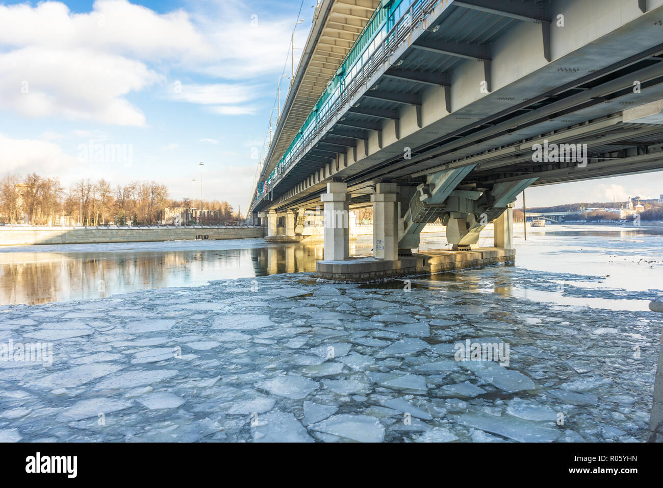 View of the bridge and the freezing river Stock Photo - Alamy