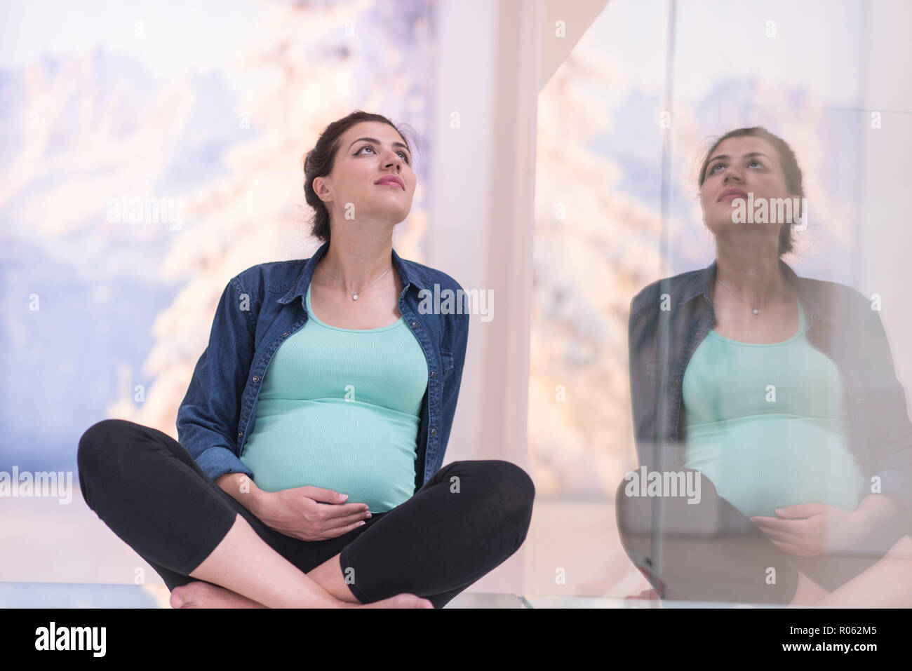 happy pregnant women enjoying pregnancy relaxing at home sitting on the ...