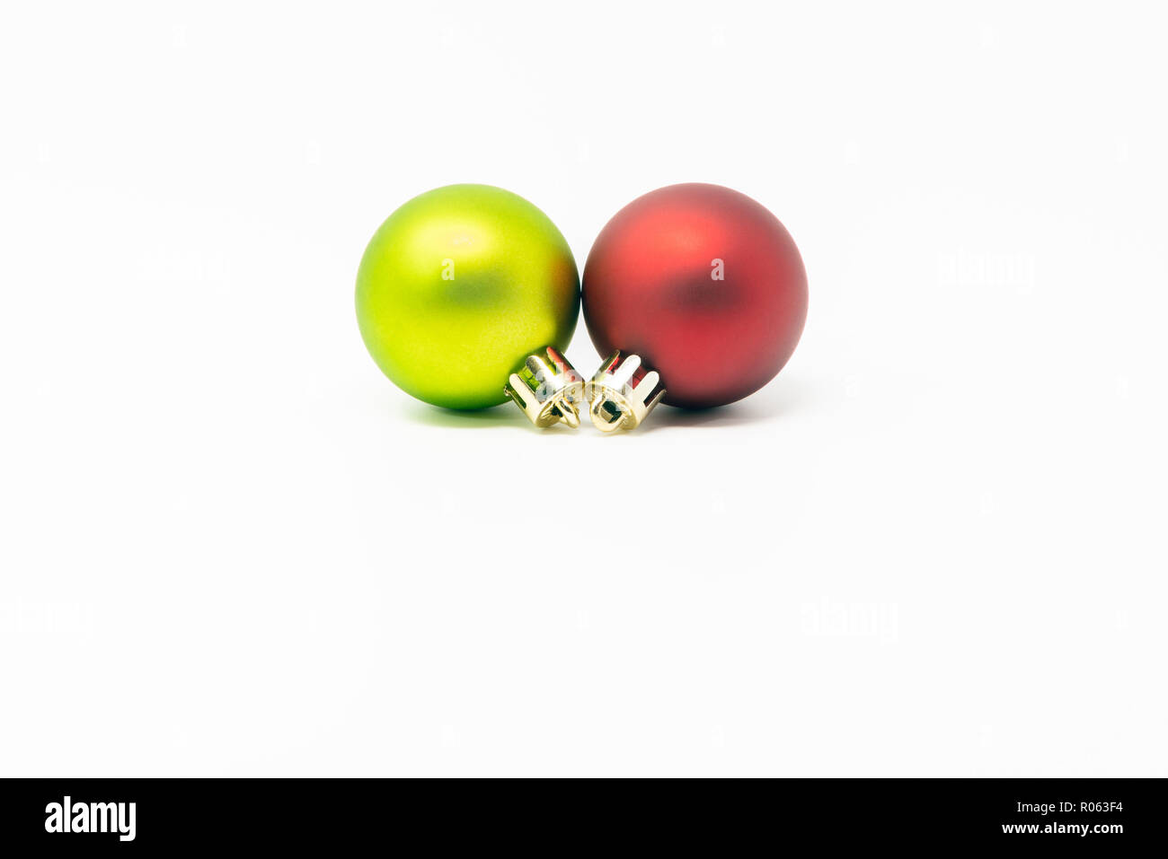 Red and green spherical Christmas decorations isolated on white ...